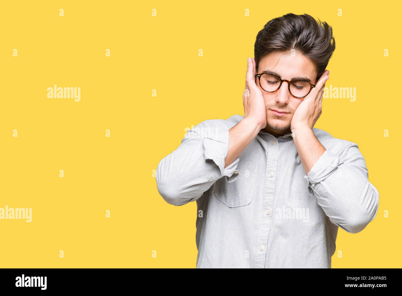 Young handsome man wearing glasses over isolated background with hand ...