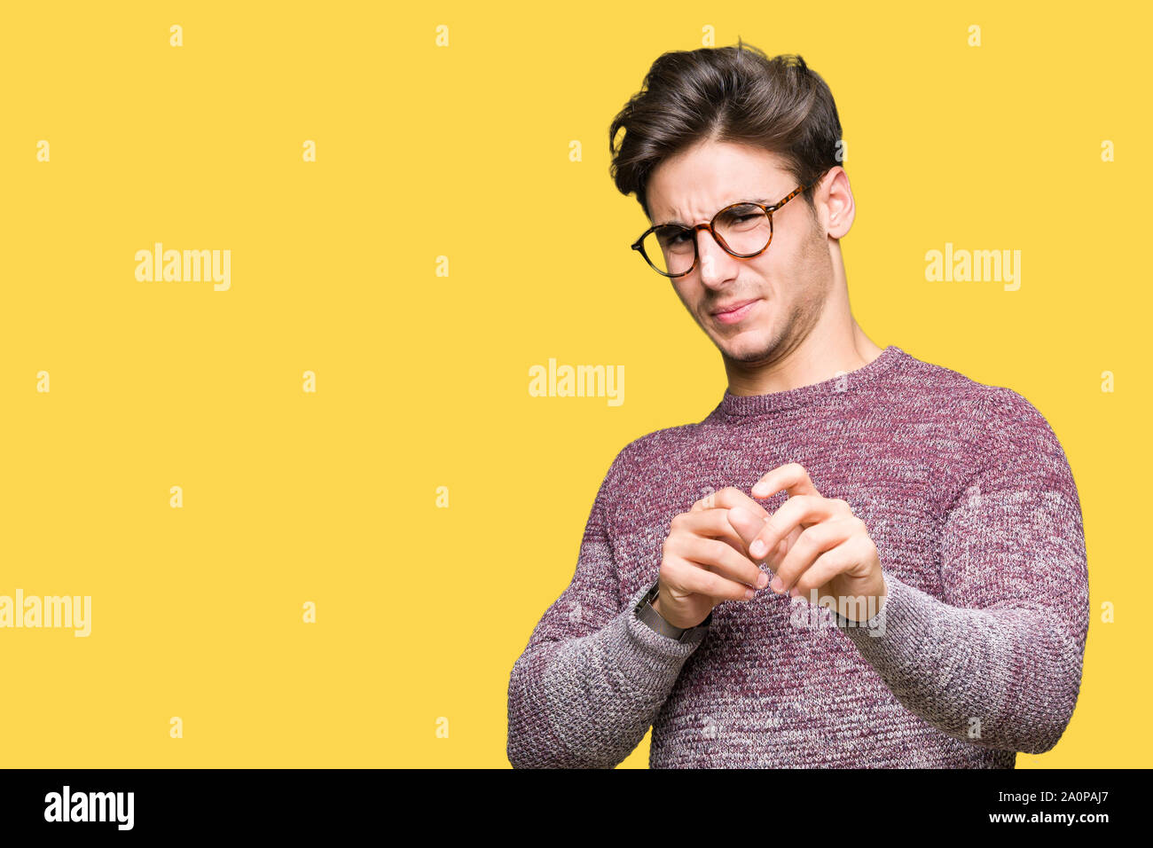 Young handsome man wearing glasses over isolated background disgusted ...