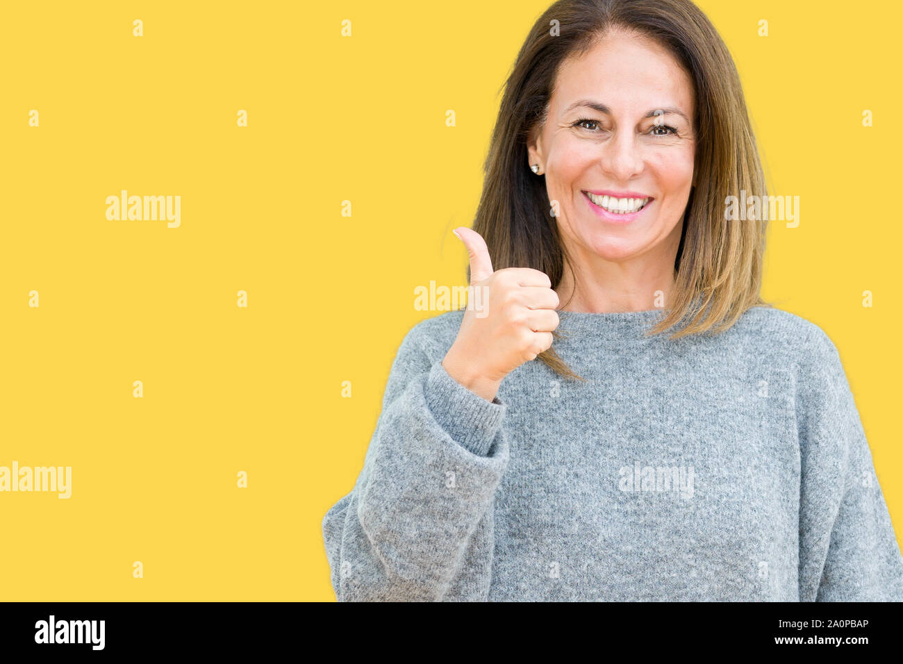 Beautiful middle age woman wearing winter sweater over isolated ...