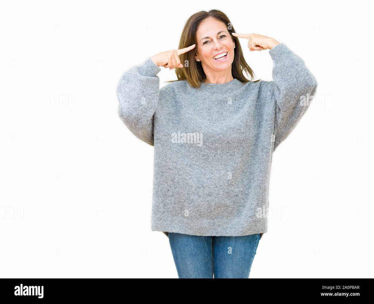 Beautiful middle age woman wearing winter sweater over isolated ...
