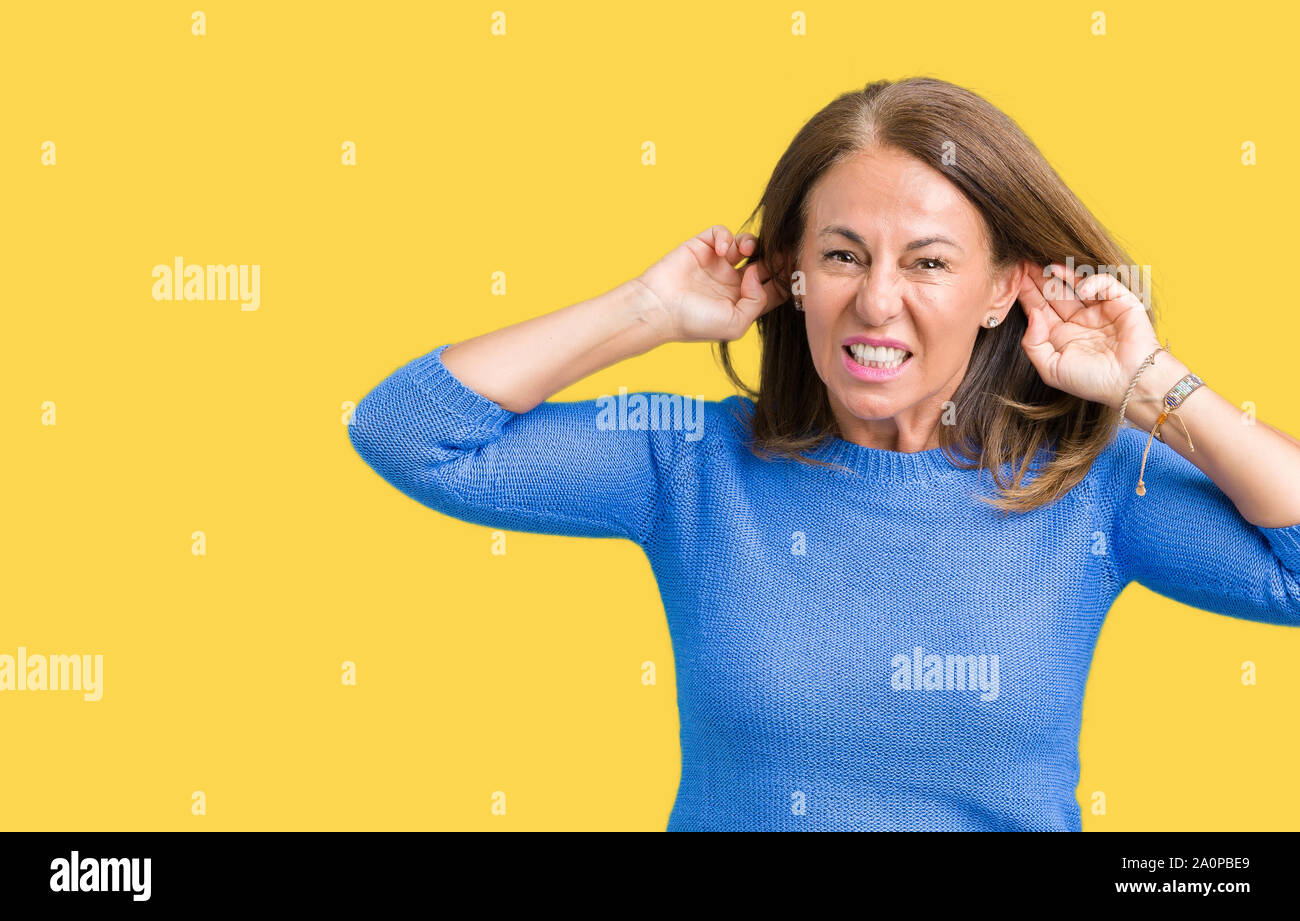 Middle age beautiful woman wearing winter sweater over isolated ...