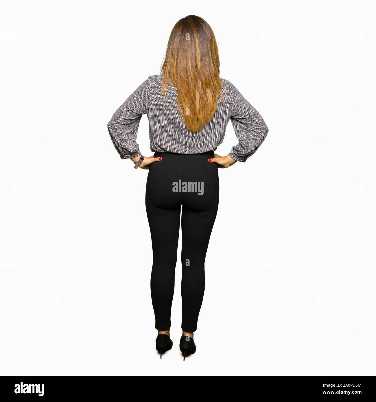 Beautiful middle age business woman standing backwards looking away ...