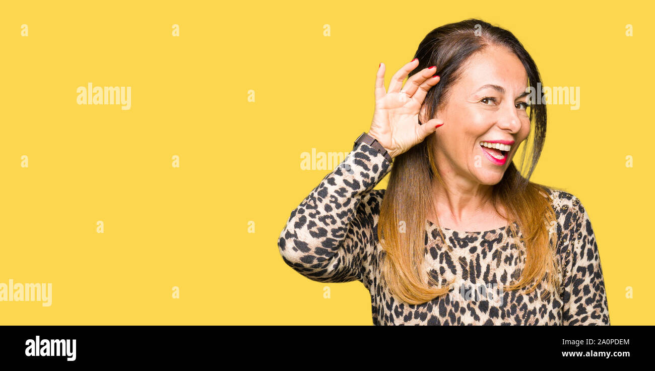 Beautiful middle age woman wearing leopard animal print dress smiling ...