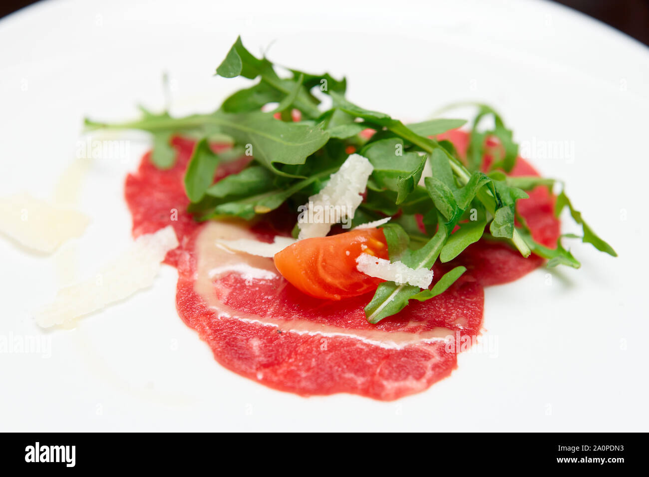 Small portion of beef capraccio close-up Stock Photo - Alamy