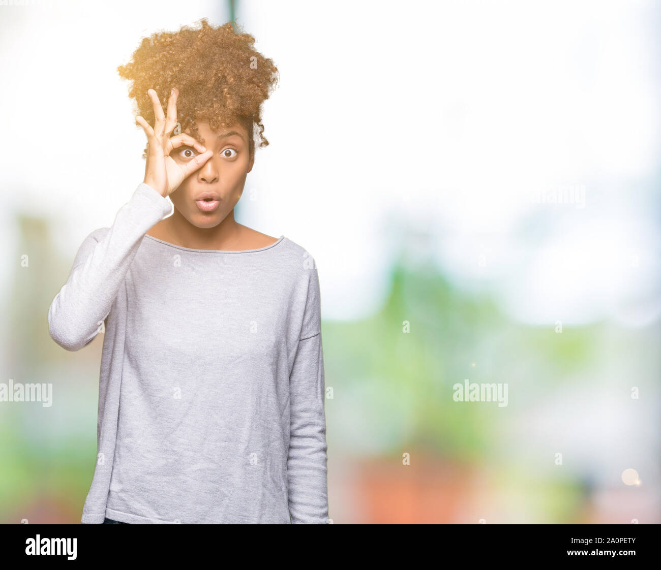 Beautiful young african american woman over isolated background doing ...