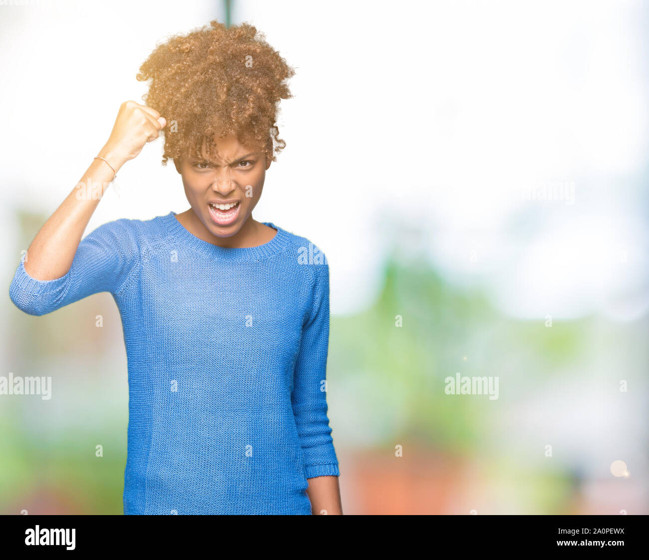 Beautiful young african american woman over isolated background angry ...