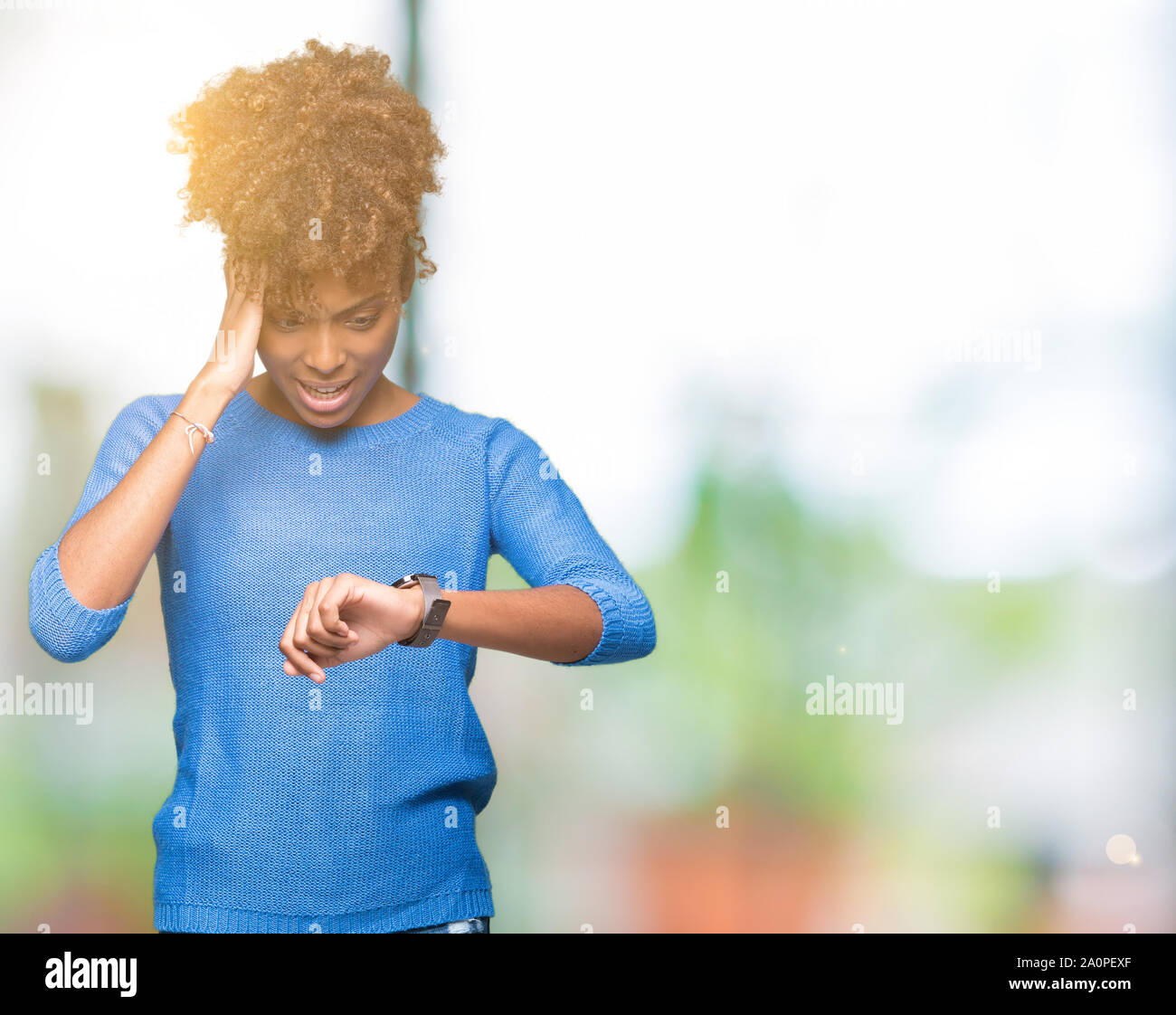 Beautiful young african american woman over isolated background Looking ...