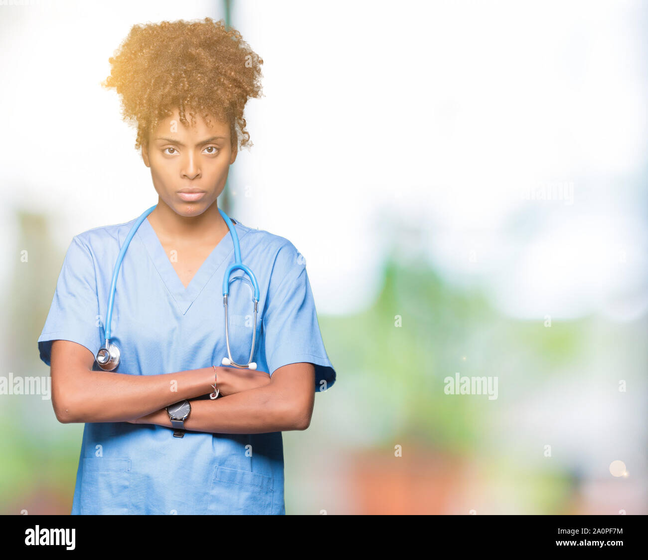 Young african american doctor woman over isolated background skeptic ...