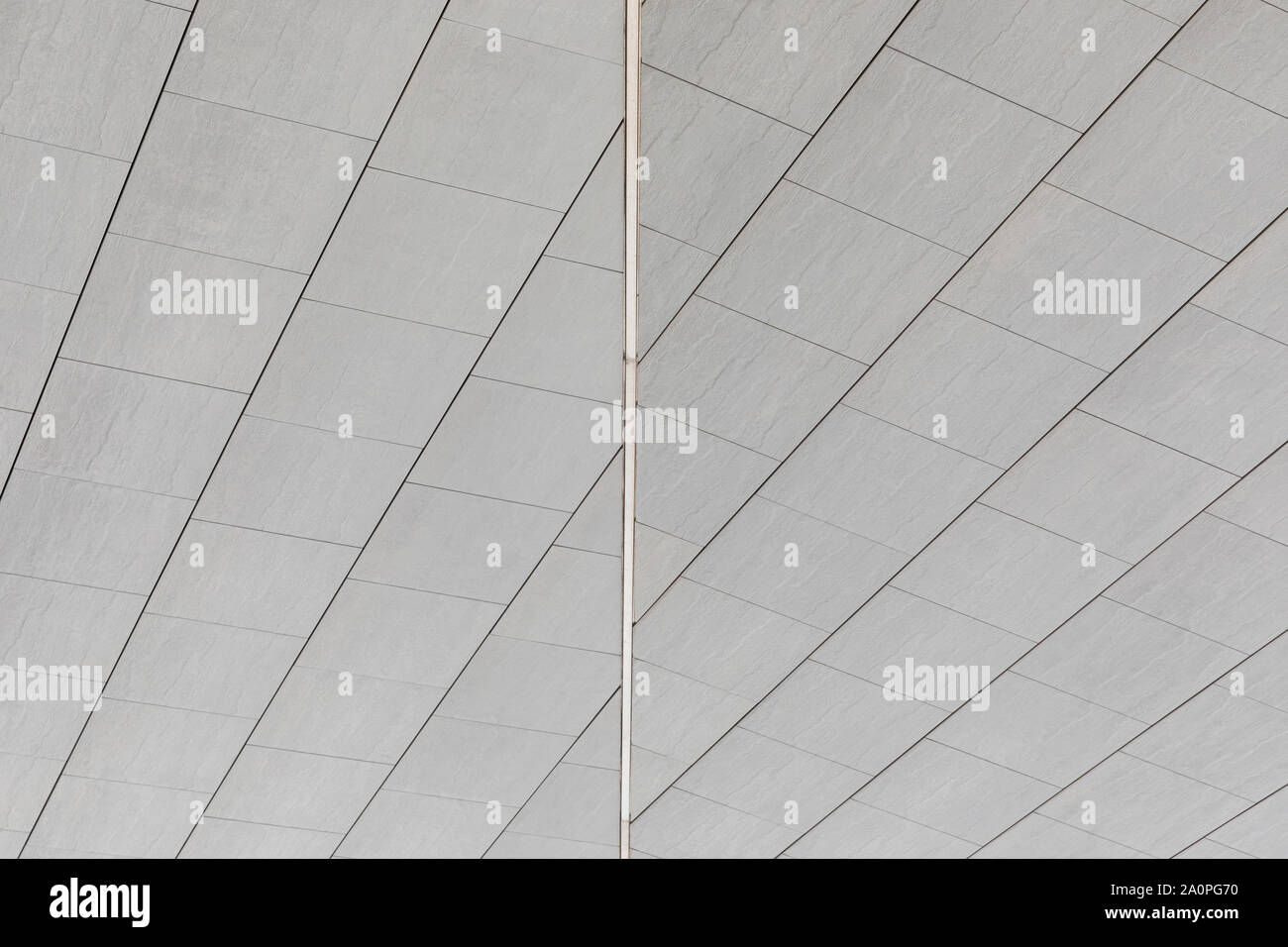 Joint line between two sides of smooth uneven gray tile on wall or ...