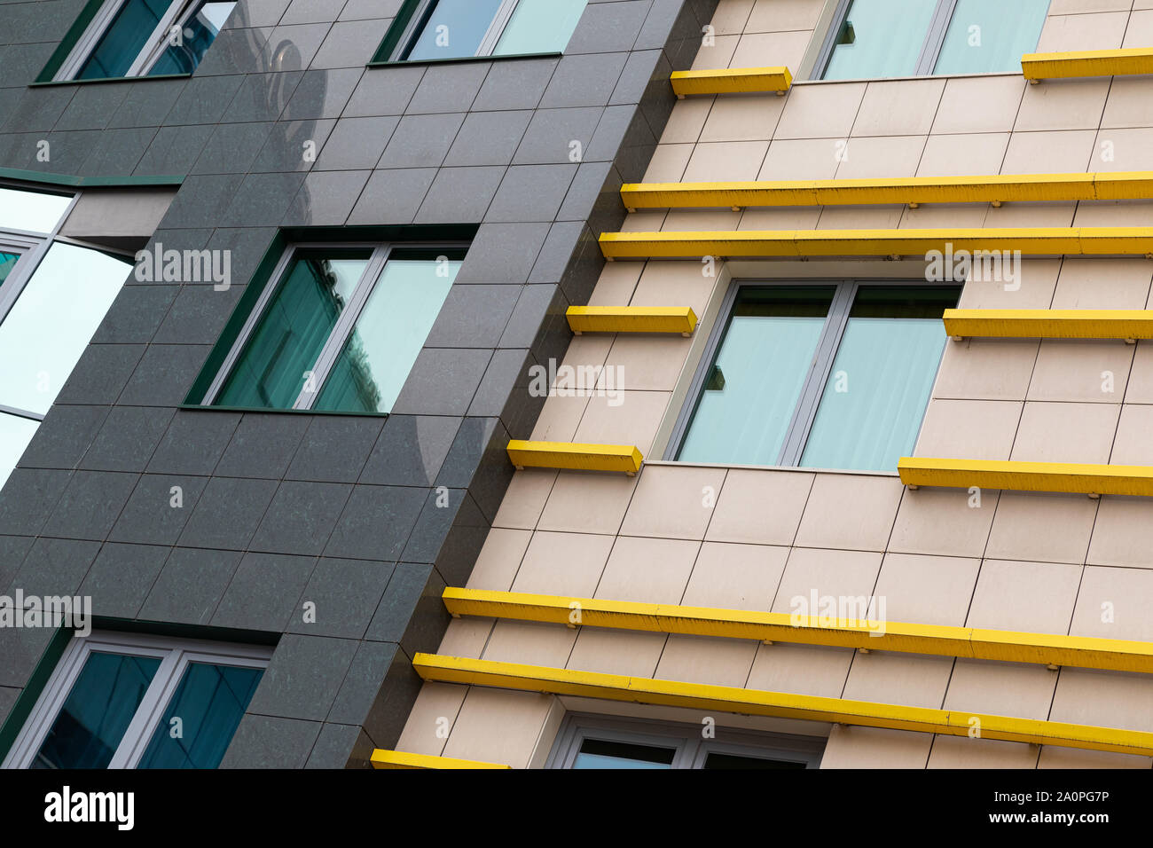 Cutting-edge tiled luxury apartment facade with beige and black ...