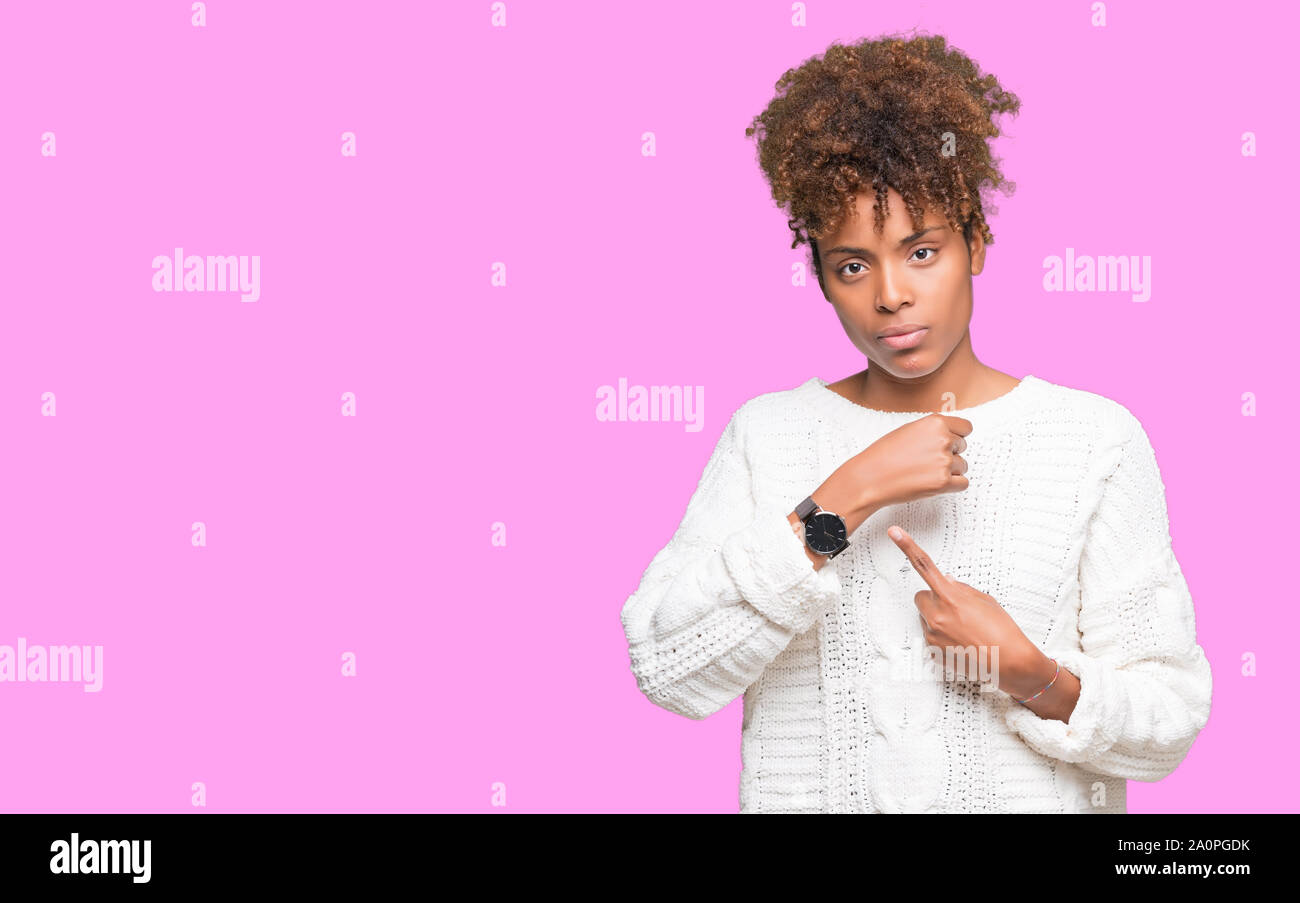 Beautiful young african american woman wearing winter sweater over ...