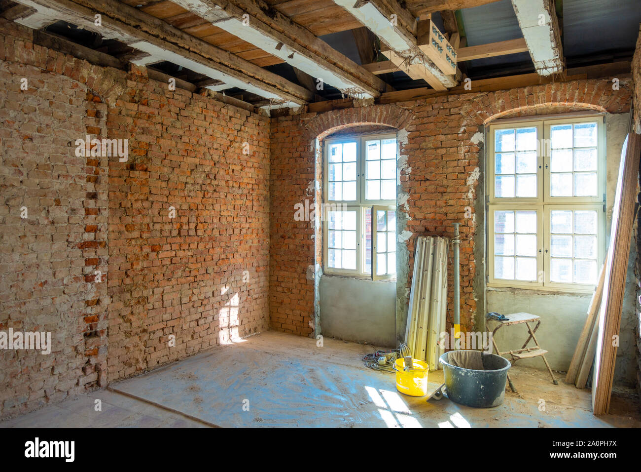 in laborious work an old house is restored Stock Photo - Alamy