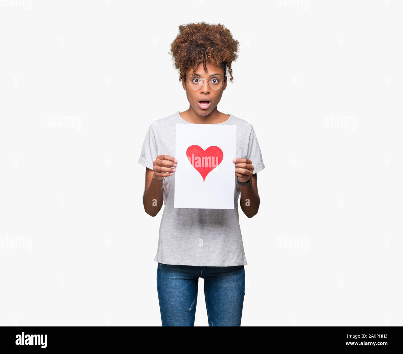 Young african american woman holding paper with red heart over isolated ...