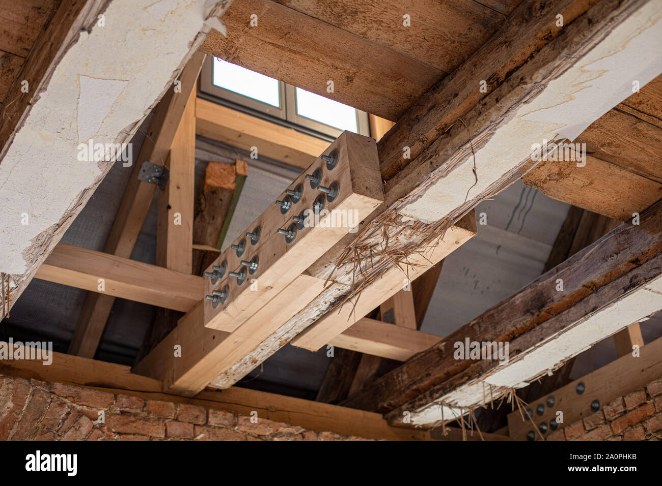 in laborious work an old house is restored, whereby old beams are ...