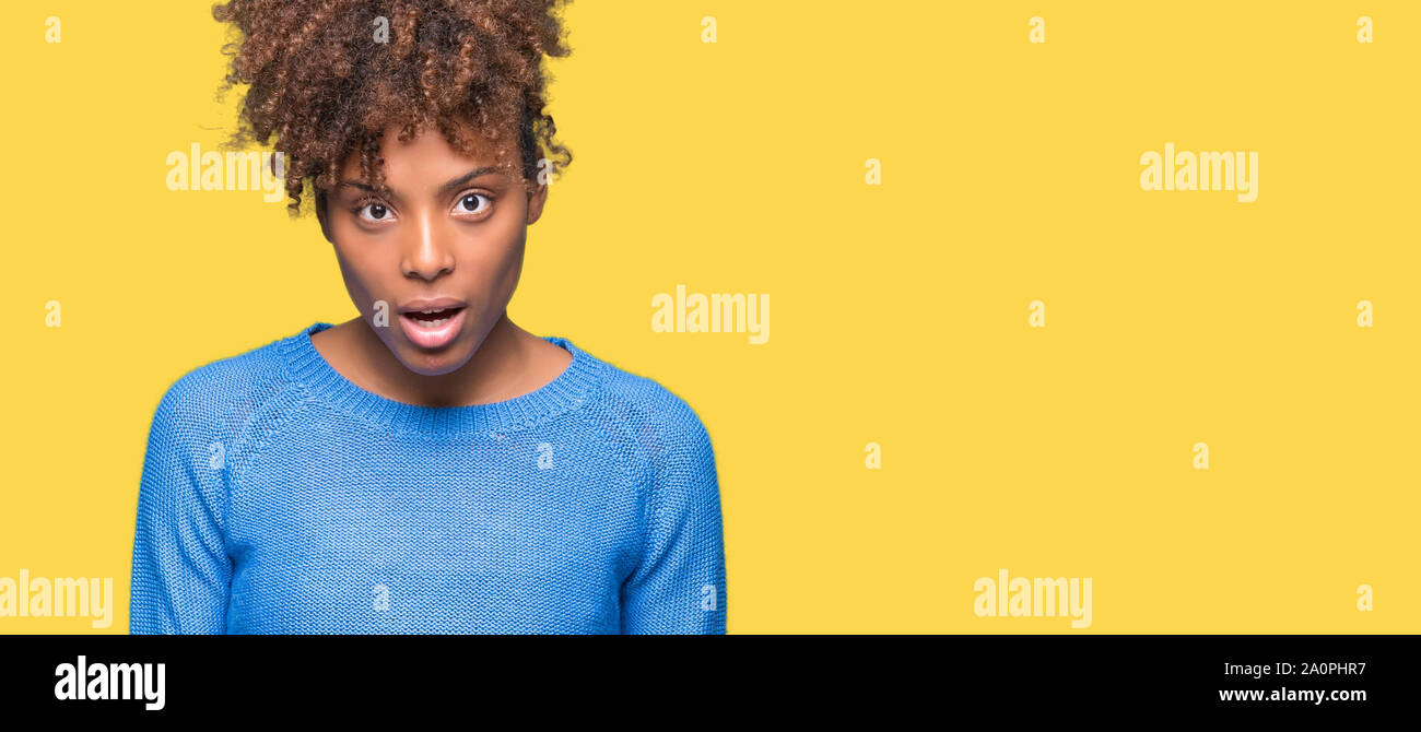 Beautiful young african american woman over isolated background In ...