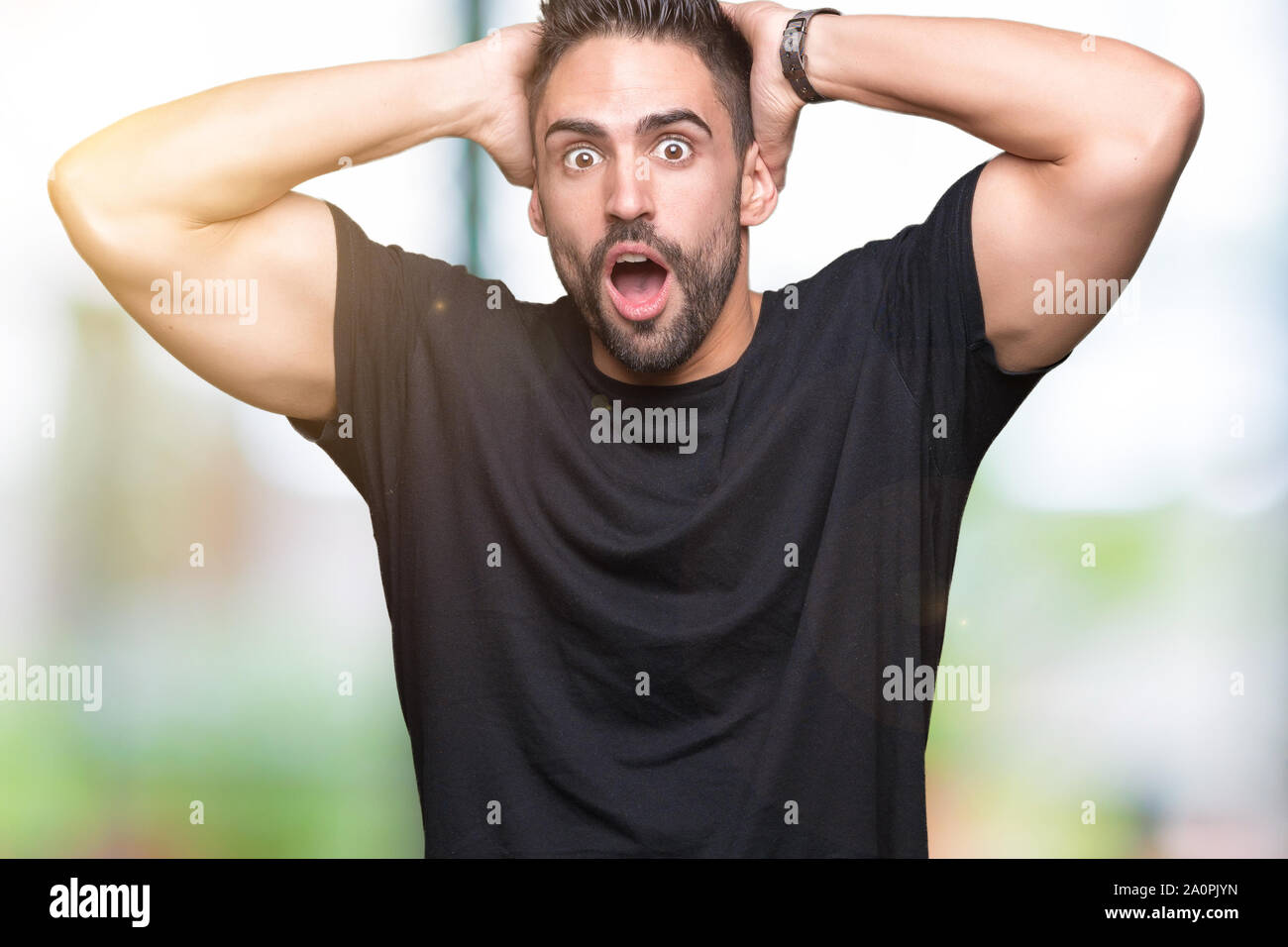 Young handsome man over isolated background Crazy and scared with hands ...