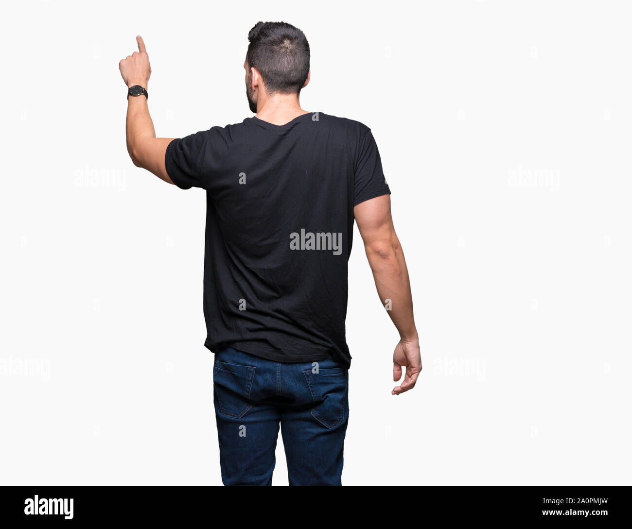 Young handsome man over isolated background Posing backwards pointing ...