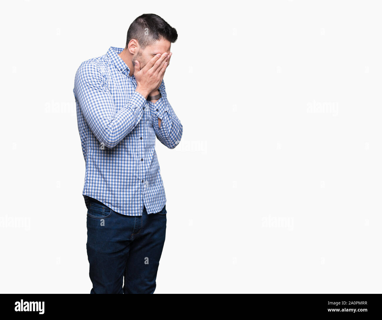 Young handsome man over isolated background with sad expression ...