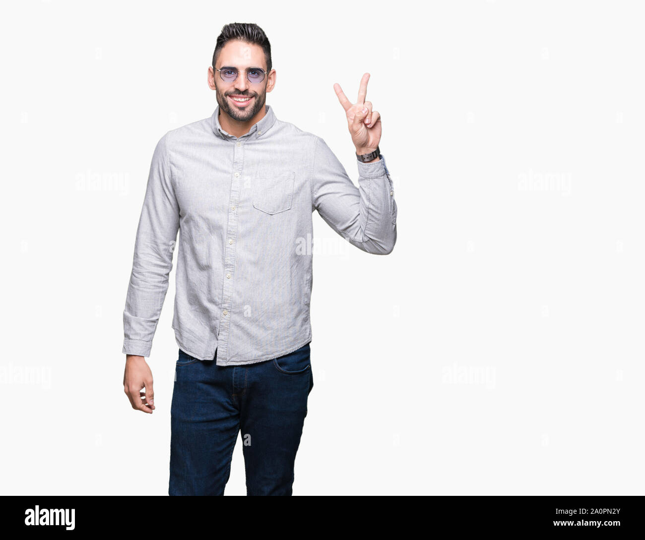 Young handsome man wearing sunglasses over isolated background smiling ...
