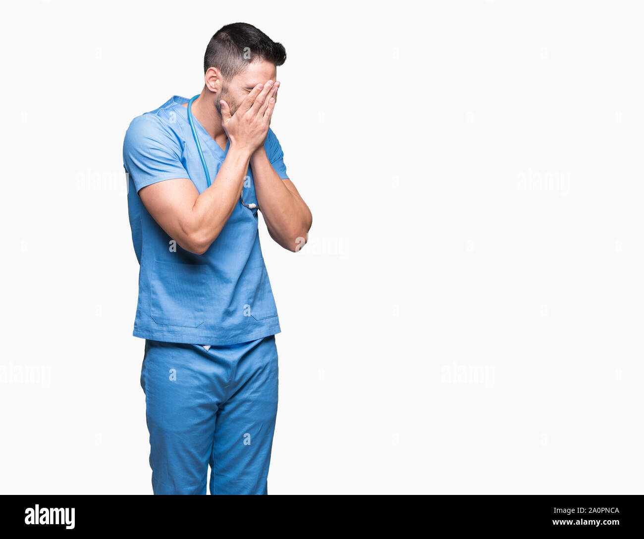 Handsome young doctor surgeon man over isolated background with sad ...
