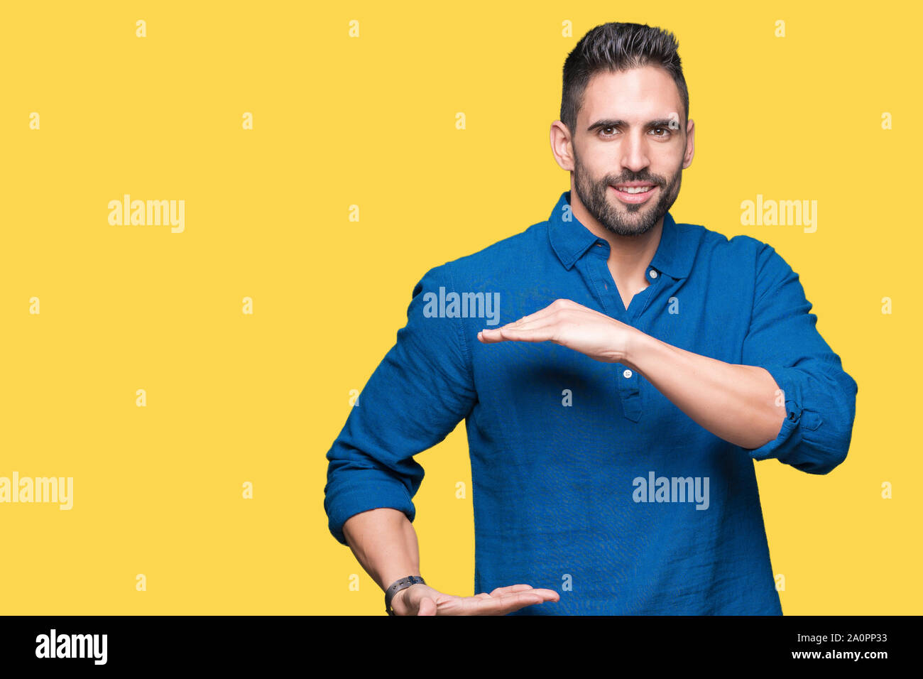 Young handsome man over isolated background gesturing with hands ...
