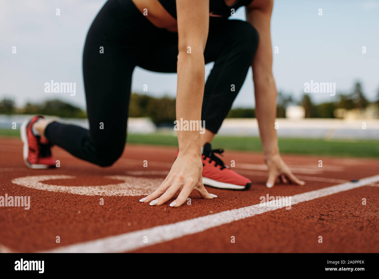 Female runner on start line, training on stadium Stock Photo - Alamy