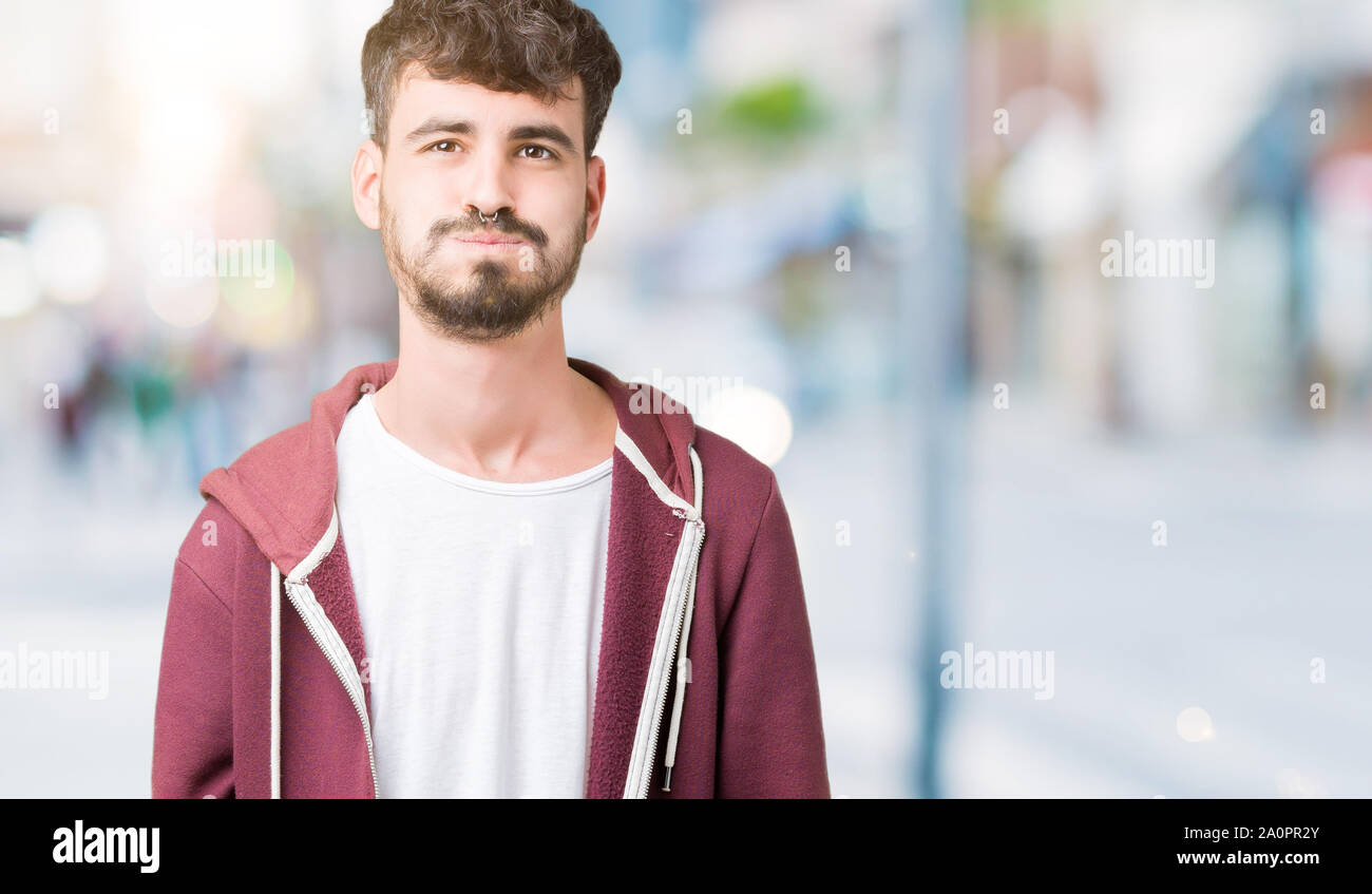 Young handsome man over isolated background puffing cheeks with funny ...