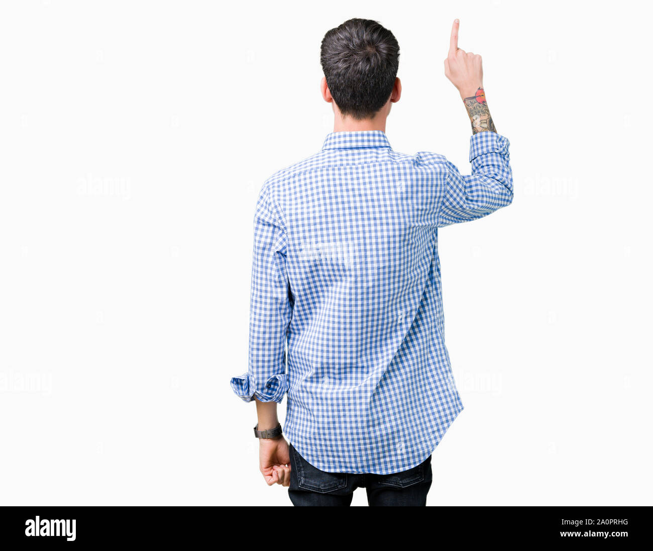 Young handsome business man over isolated background Posing backwards ...