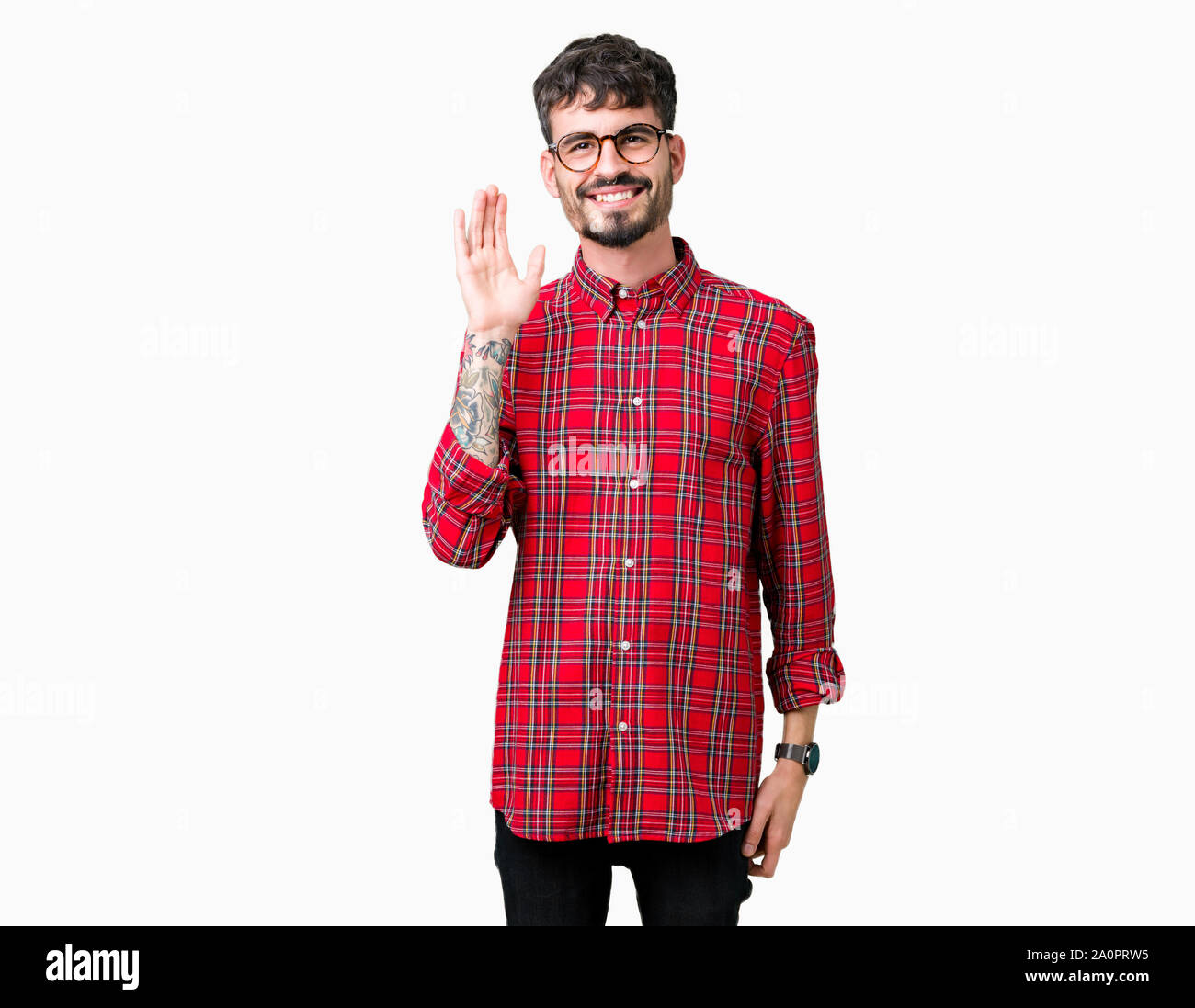 Young handsome man wearing glasses over isolated background Waiving ...