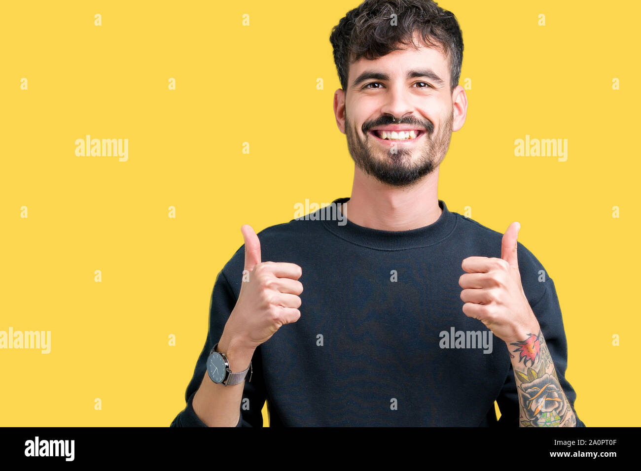 Young handsome man over isolated background success sign doing positive ...