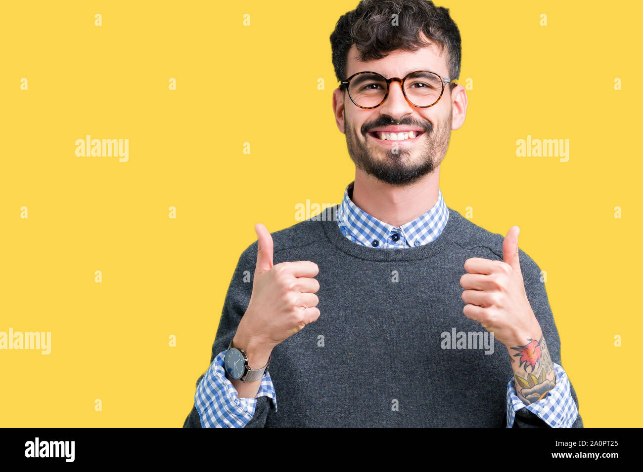 Young handsome smart man wearing glasses over isolated background ...