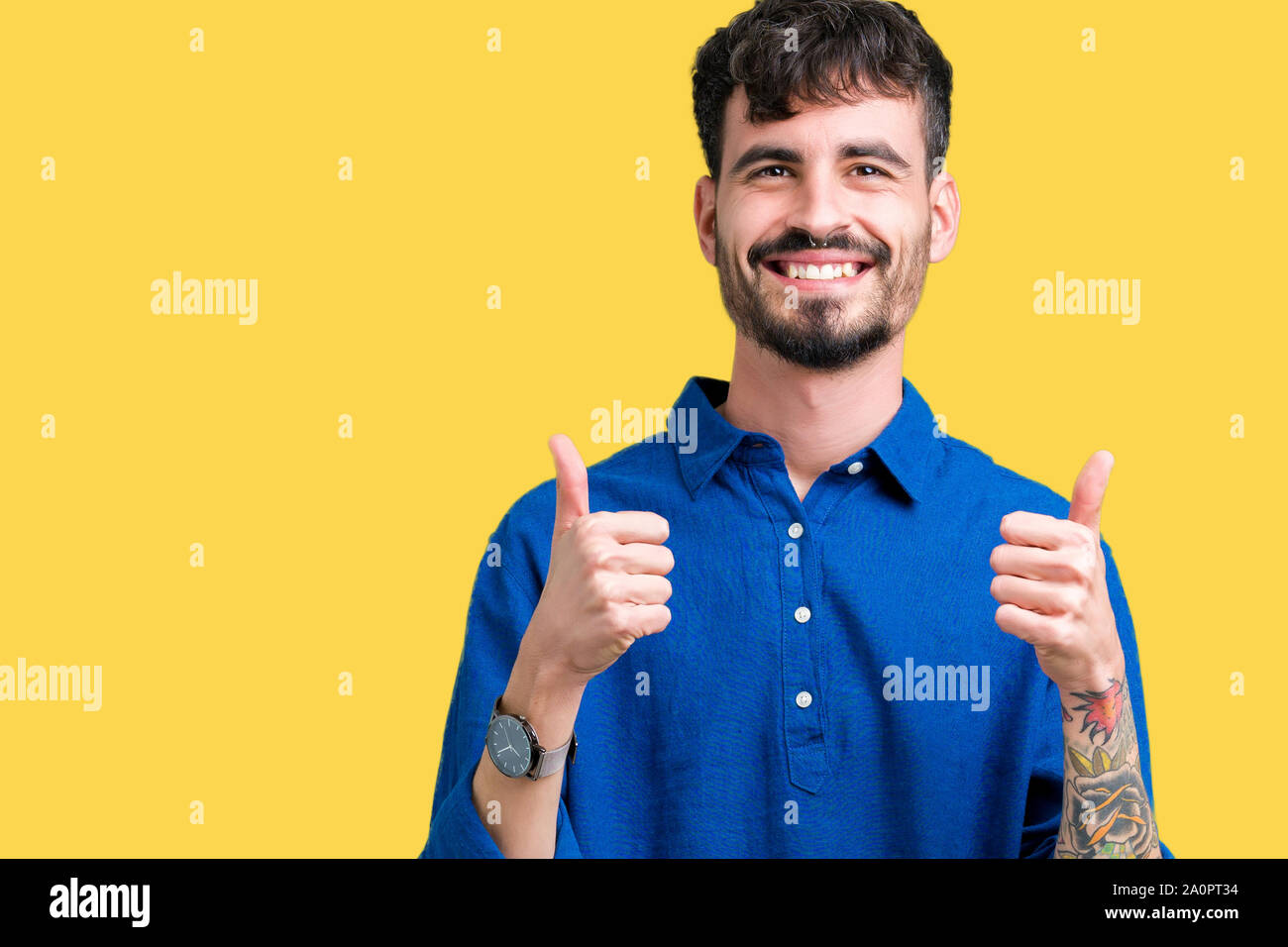 Young handsome man over isolated background success sign doing positive ...