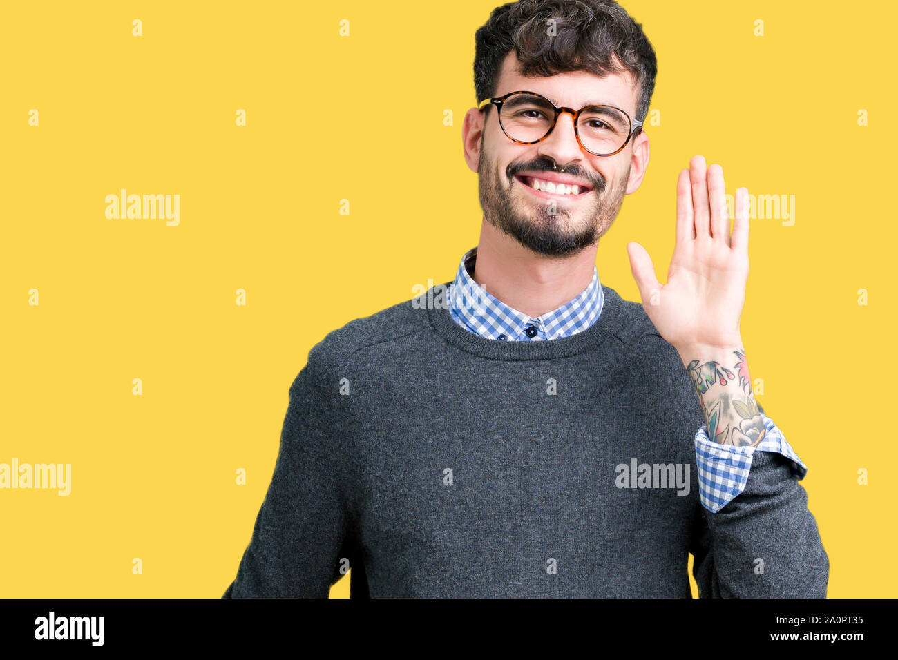 Young handsome smart man wearing glasses over isolated background ...