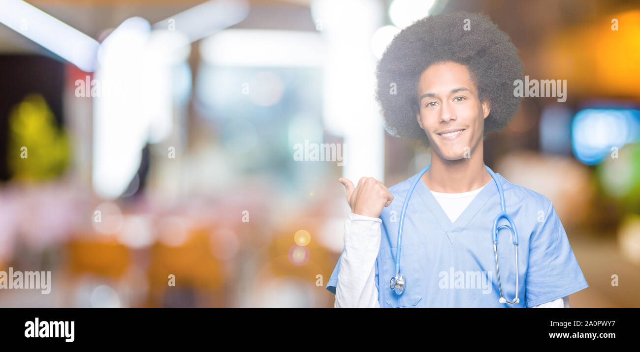 Young african american doctor man with afro hair smiling with happy ...