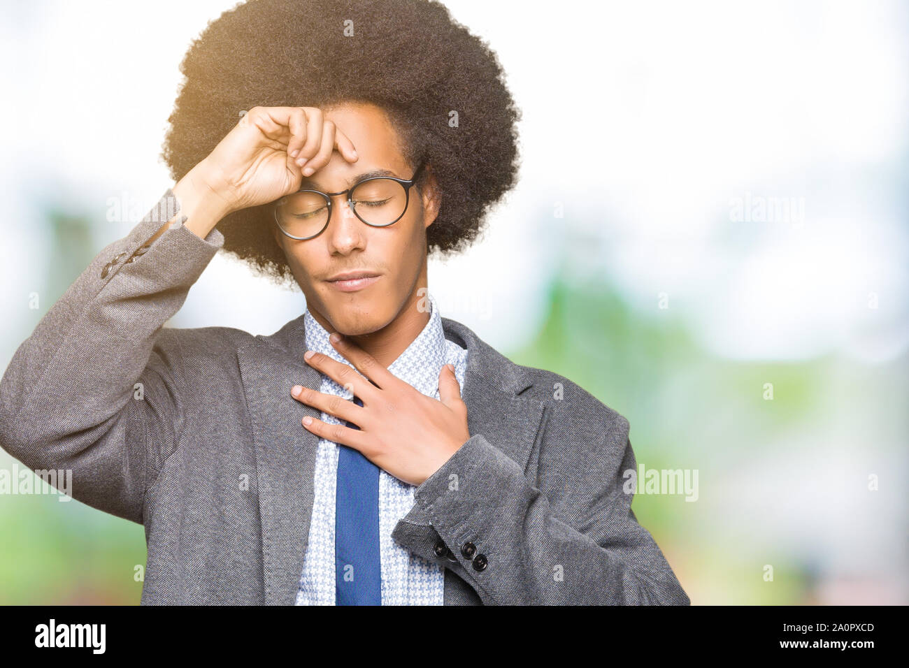 Young african american business man with afro hair wearing glasses ...