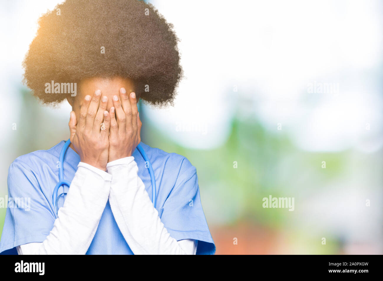 Young african american doctor man with afro hair with sad expression ...