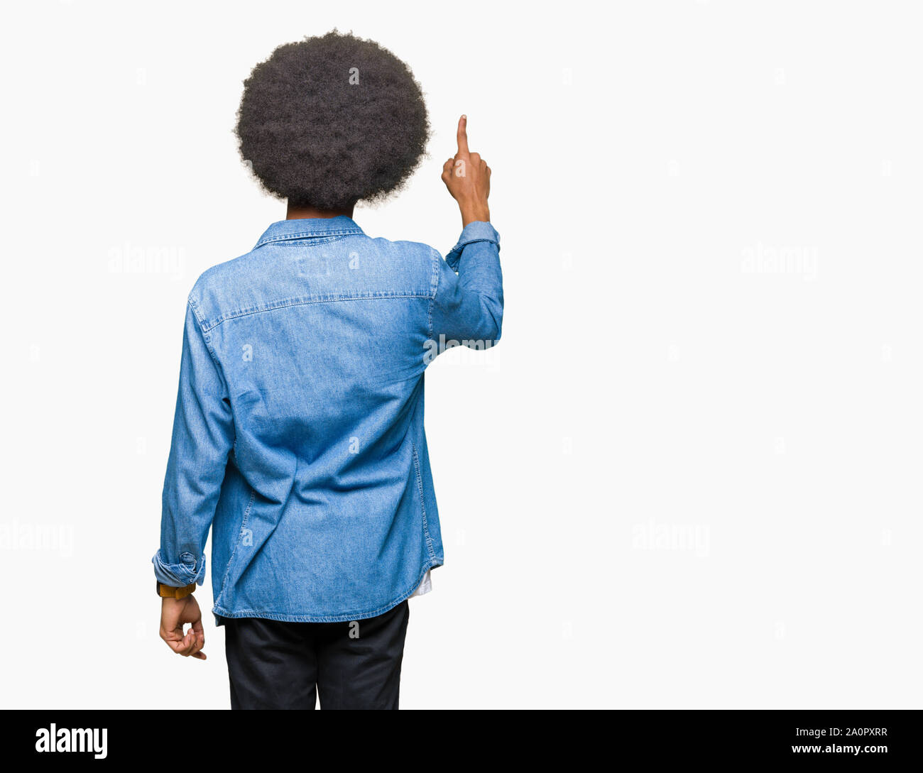 Young african american man with afro hair Posing backwards pointing ...