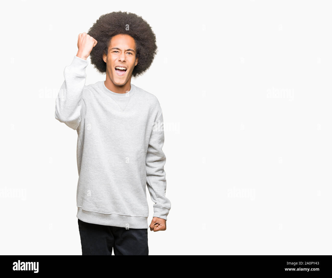 Young african american man with afro hair wearing sporty sweatshirt ...