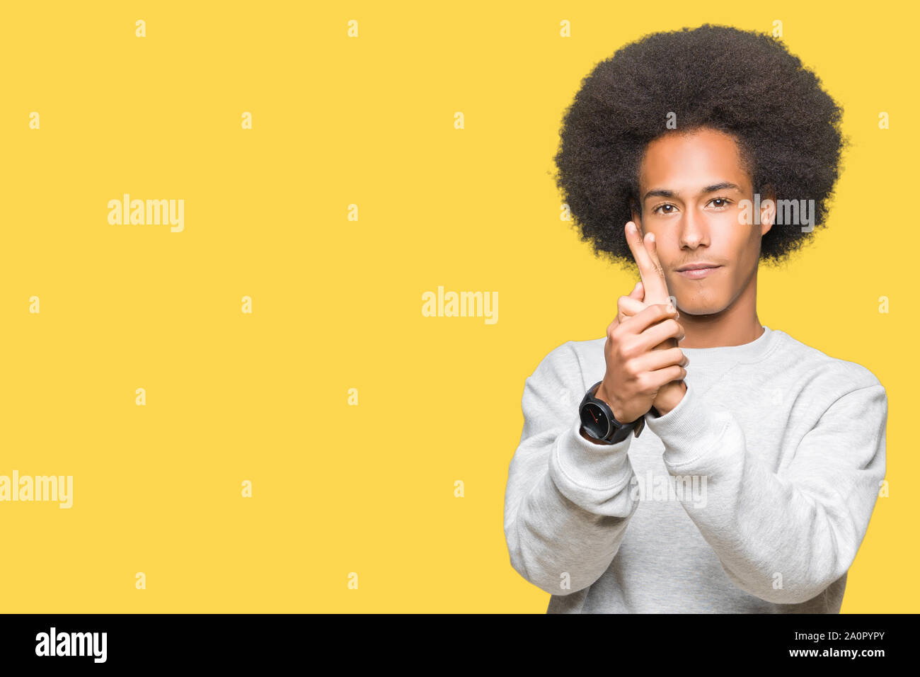 Young african american man with afro hair wearing sporty sweatshirt ...
