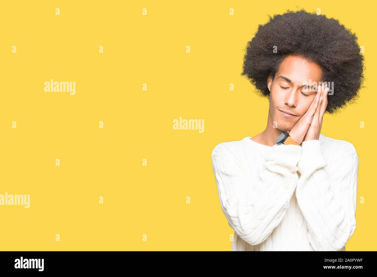 Young african american man with afro hair wearing winter sweater ...