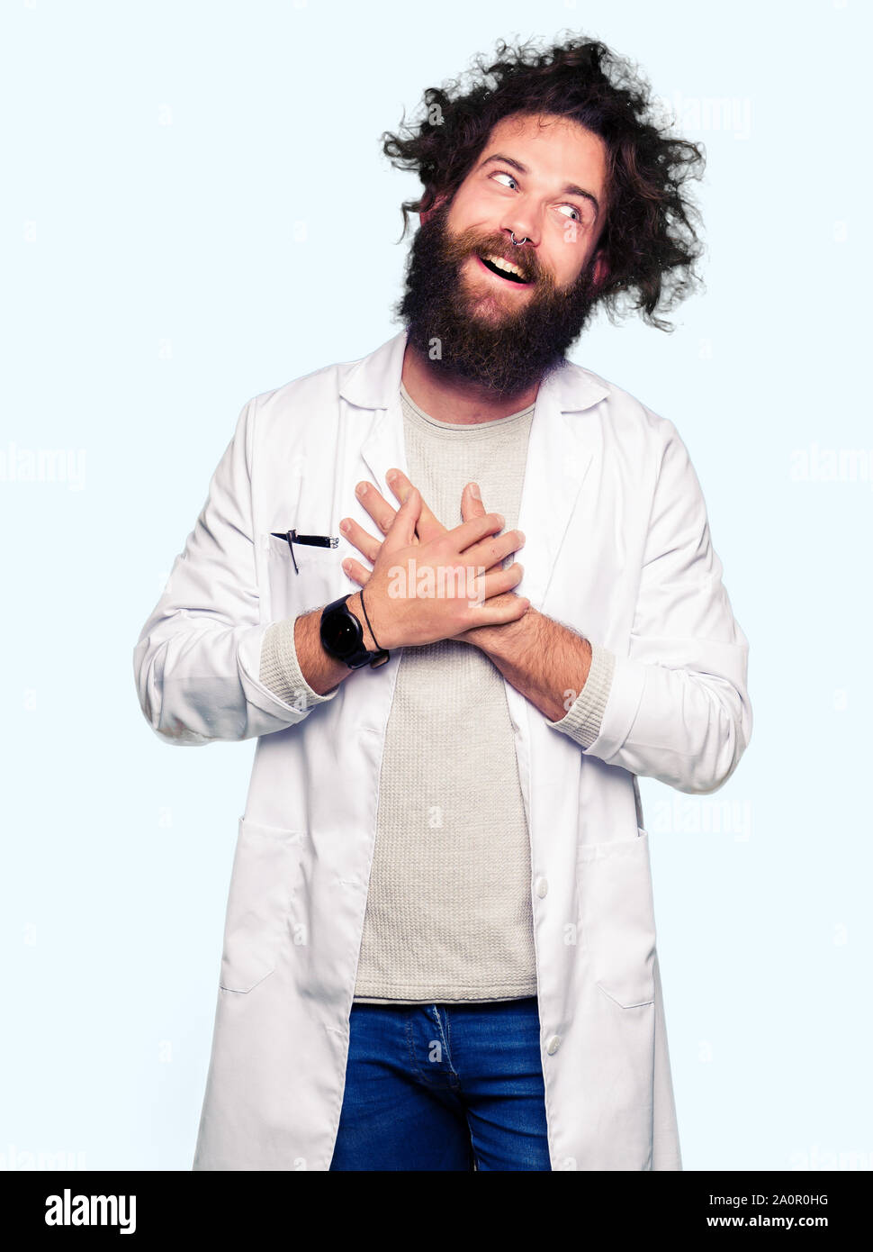 Crazy scientist with funny long hair smiling with hands on chest with ...