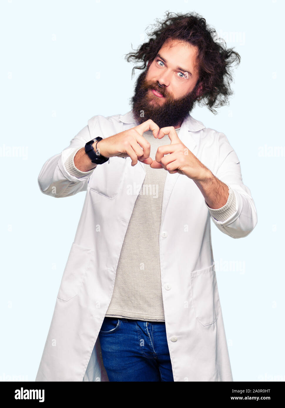 Crazy scientist with funny long hair smiling in love showing heart ...