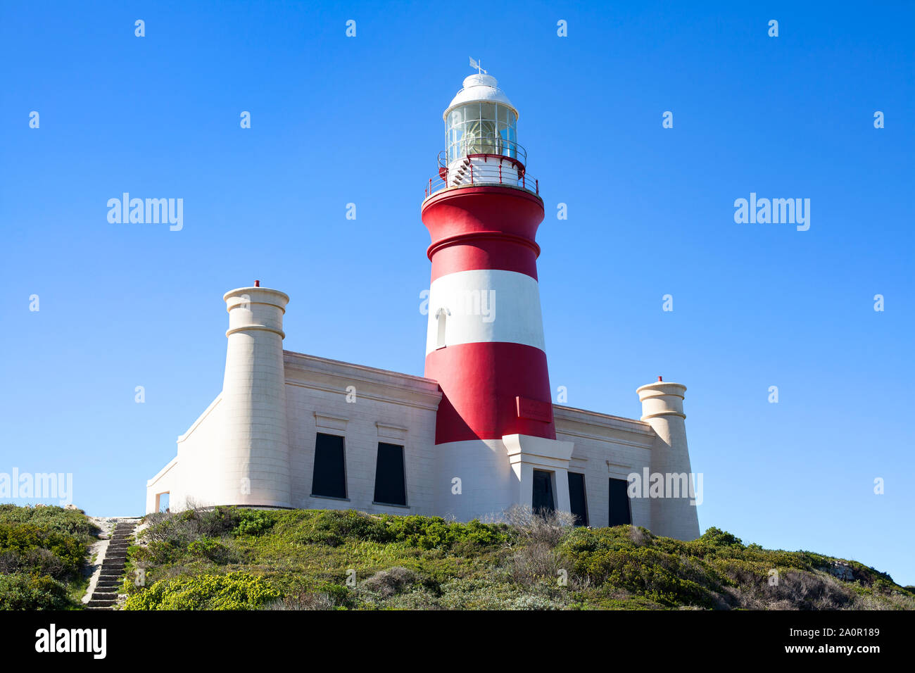 Lighthouse on Cape Agulhas in South Africa on blue sky background ...