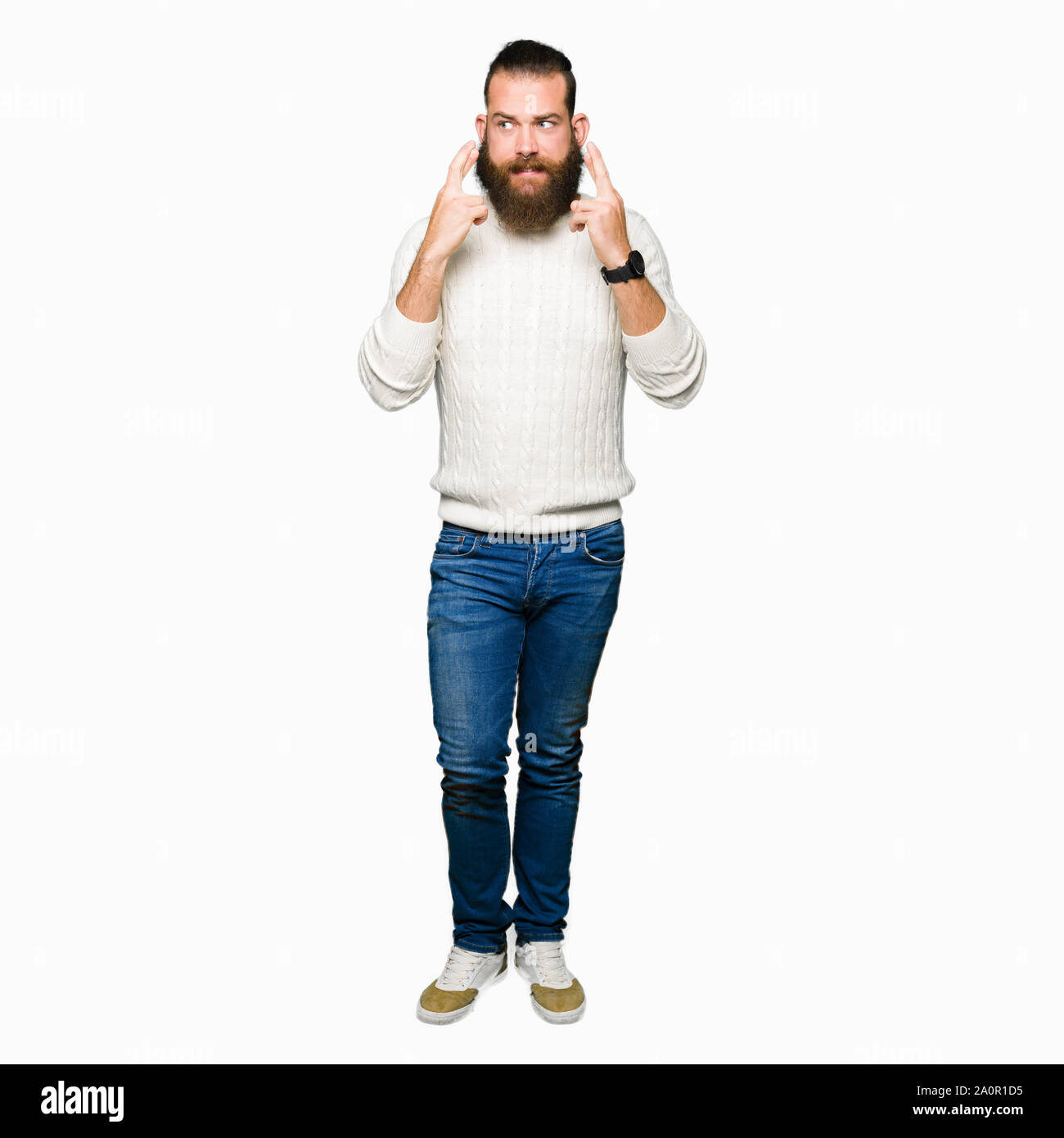 Young hopeful man crossing Cut Out Stock Images & Pictures - Alamy