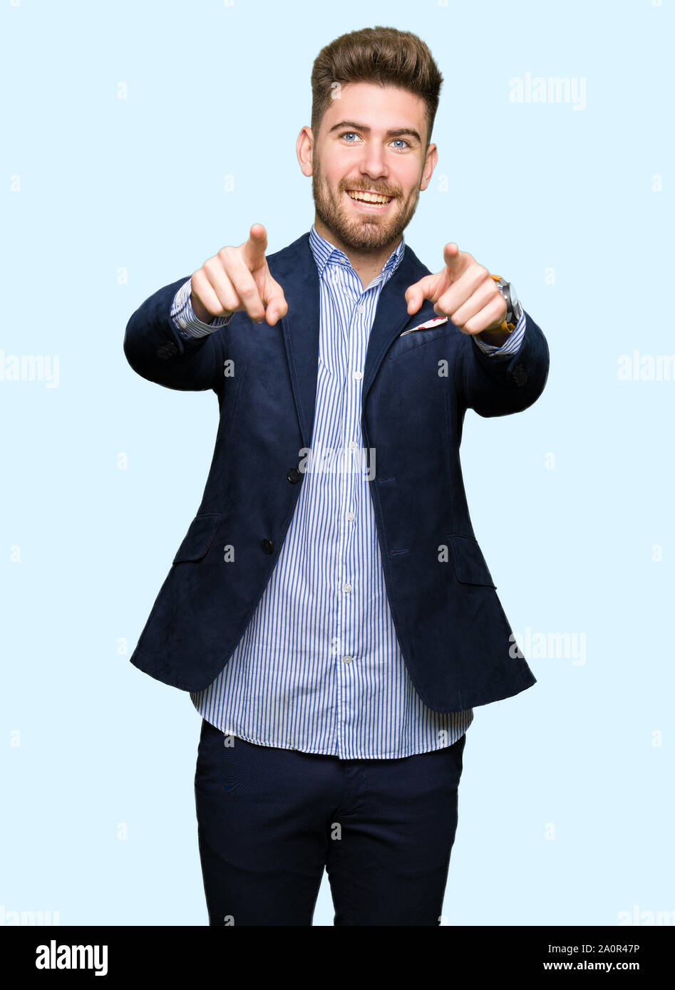 Young handsome bussines man Pointing to you and the camera with fingers ...