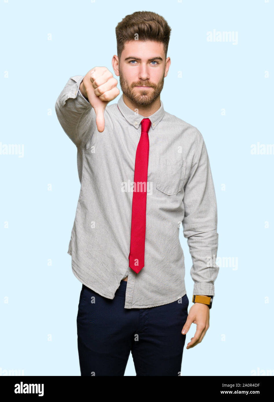 Young handsome business man looking unhappy and angry showing rejection ...