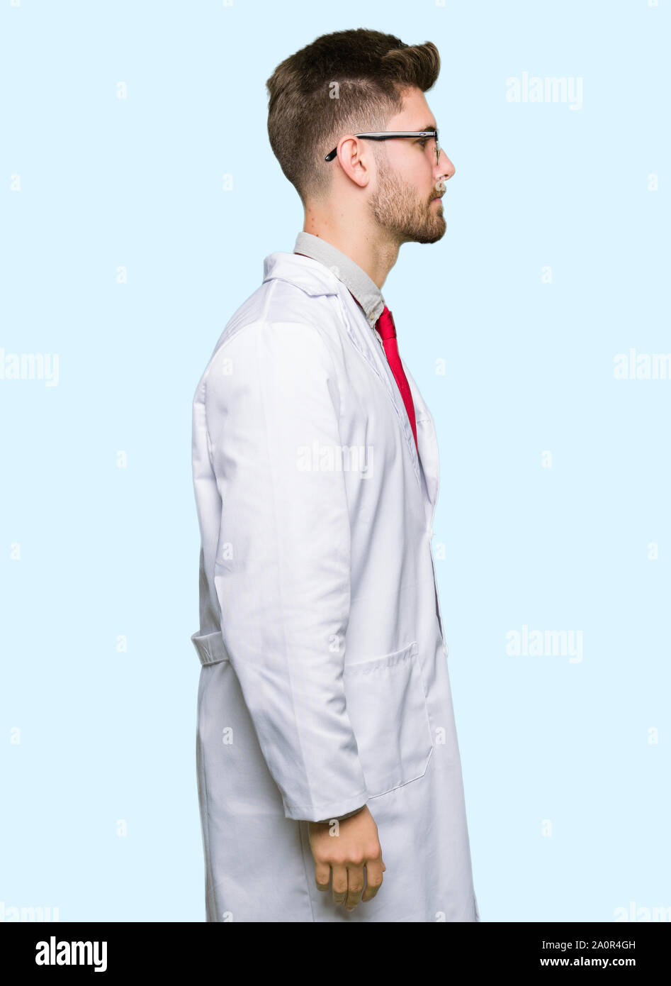 Young handsome scientist man wearing glasses looking to side, relax ...