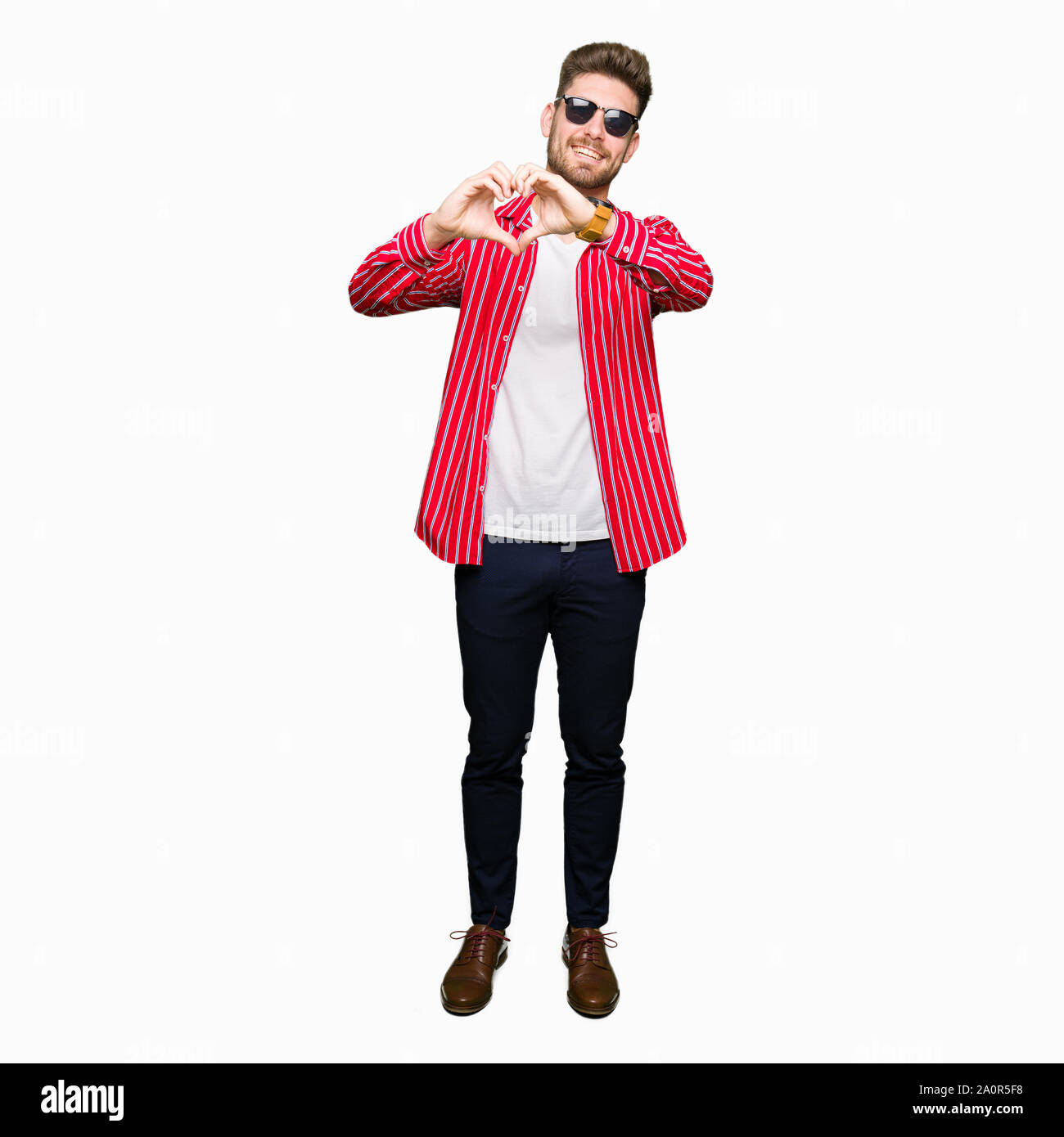 Young couple wearing heart Cut Out Stock Images & Pictures - Alamy