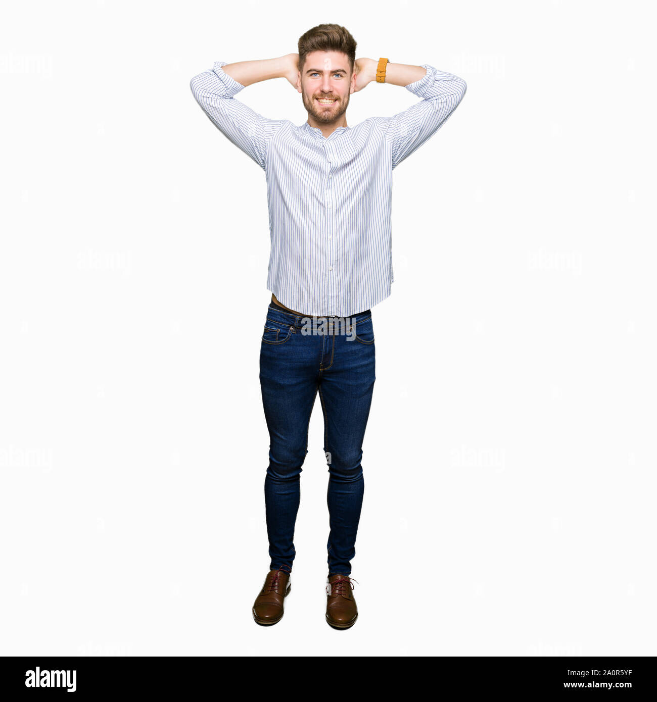 Young handsome man Relaxing and stretching with arms and hands behind ...