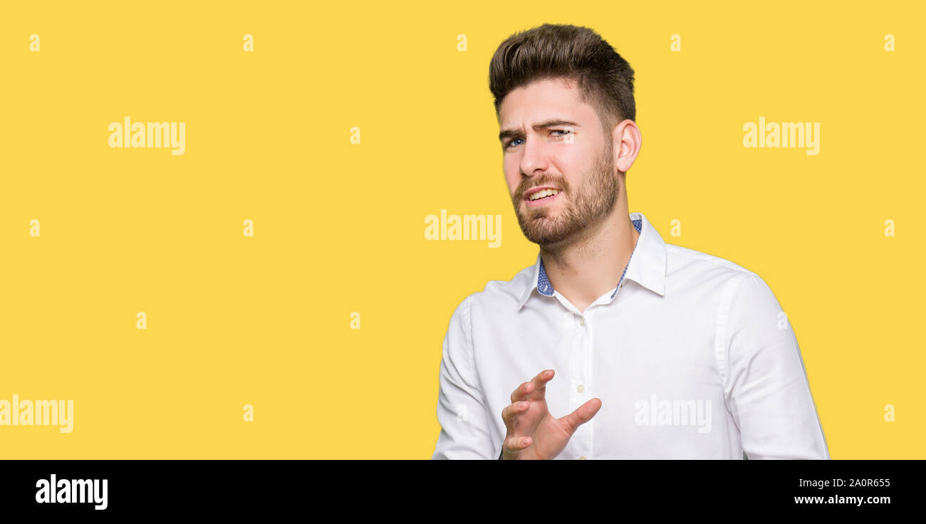 Young handsome business man disgusted expression, displeased and ...